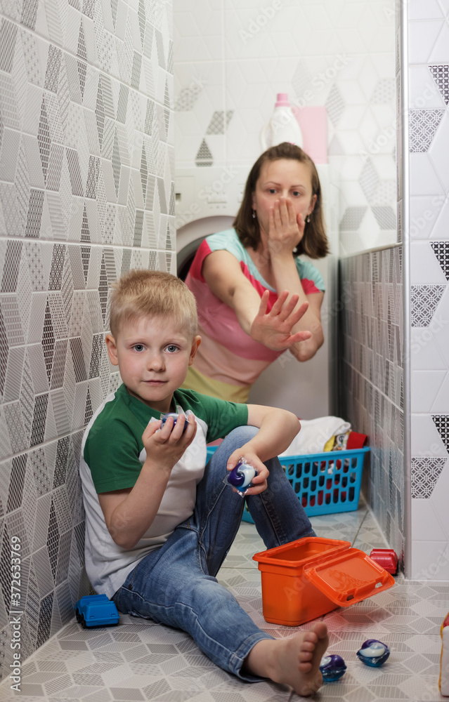 Bathroom. Danger of poisoning a child with washing capsules Stock Photo ...