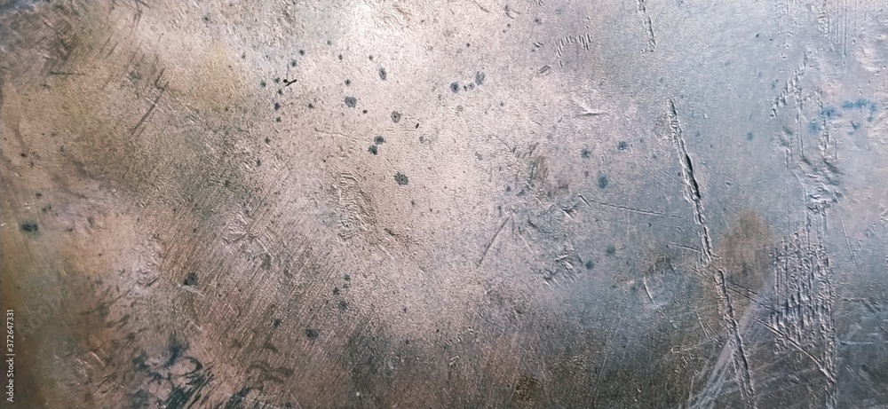 Bronze metal surface. Uneven metal texture with scratches, gouges and ...