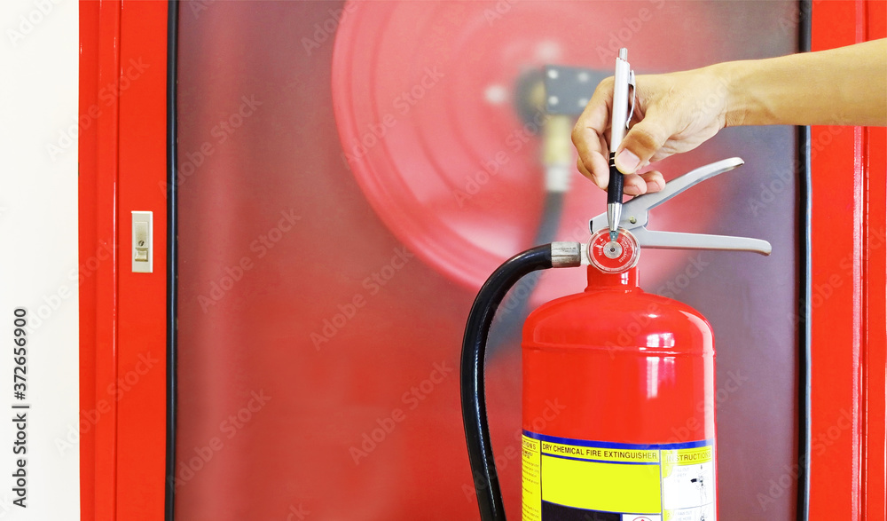 Engineer checking Industrial fire control system.a fire extinguishers ...