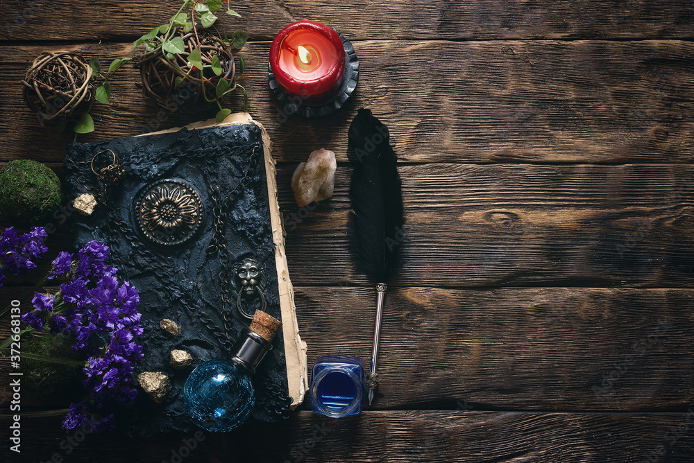 Spell book, magic potions and other various witchcraft accessories on ...