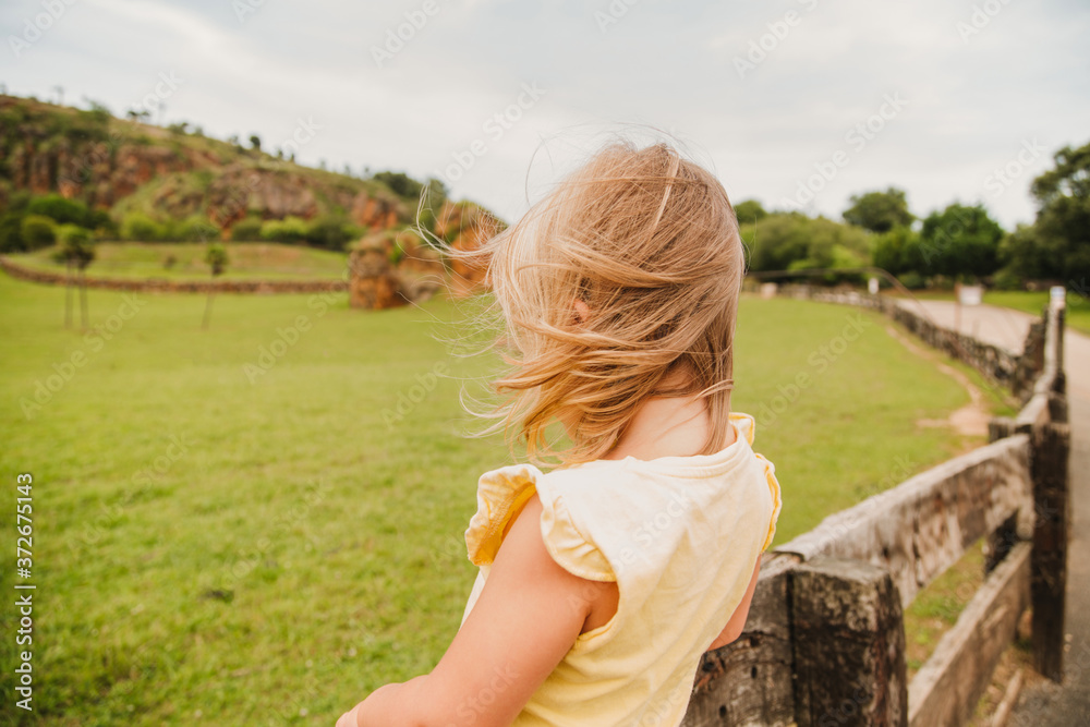 Little girl in her back Stock Photo | Adobe Stock