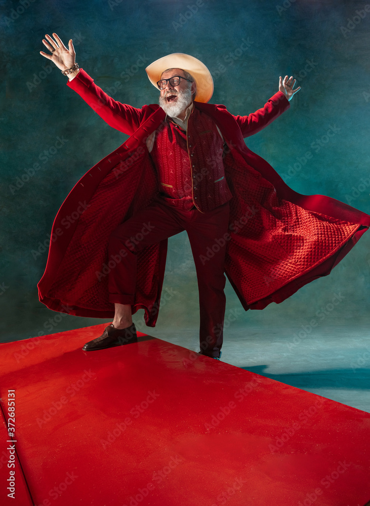 The greatest. Modern stylish Santa Claus in red fashionable suit and ...