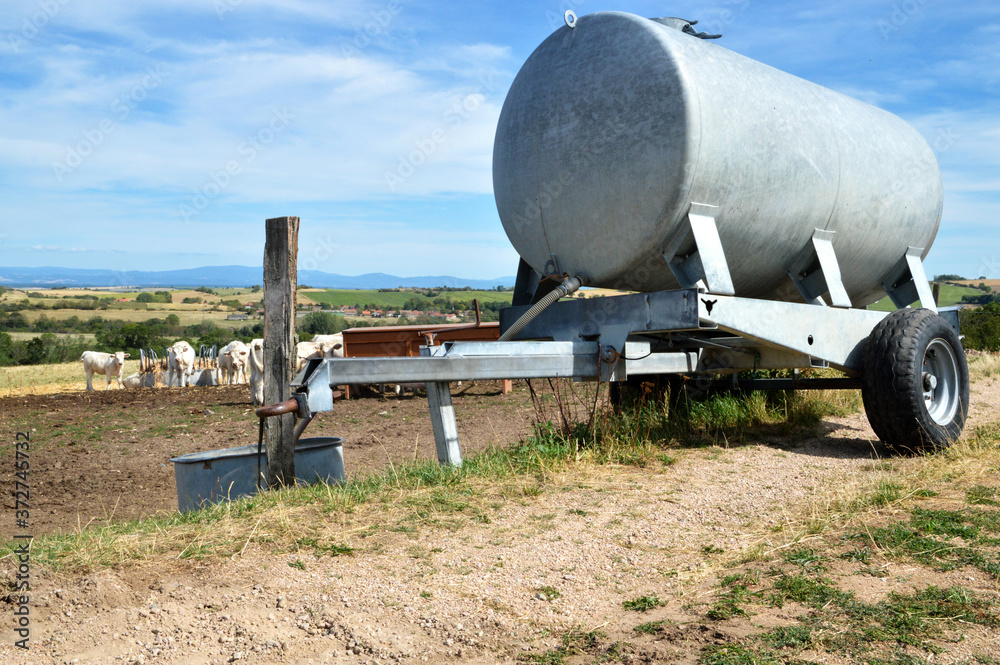 Agricultural equipment with a water tank trailer for livestock during ...