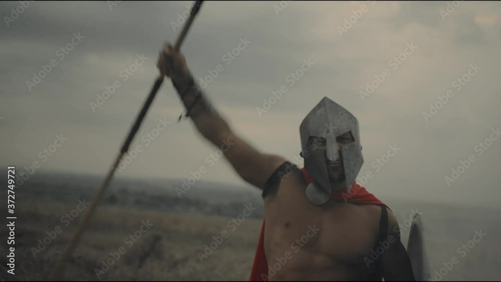 Shirtless spartan raising spear three times, victory. Stock Video ...