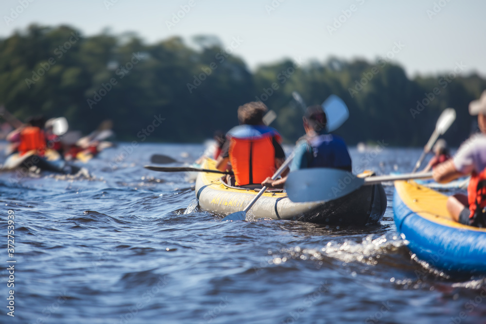 A process of kayaking in the city river canals, with colorful canoe ...