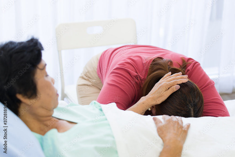 Daughter came to visit the sick mother. Stock Photo | Adobe Stock