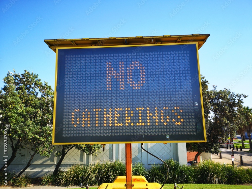 No Gatherings sign at St Kilda after numerous people ignored ...