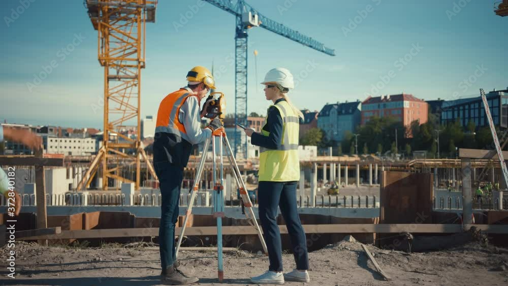 Construction Worker Using Theodolite Surveying Optical Instrument for ...