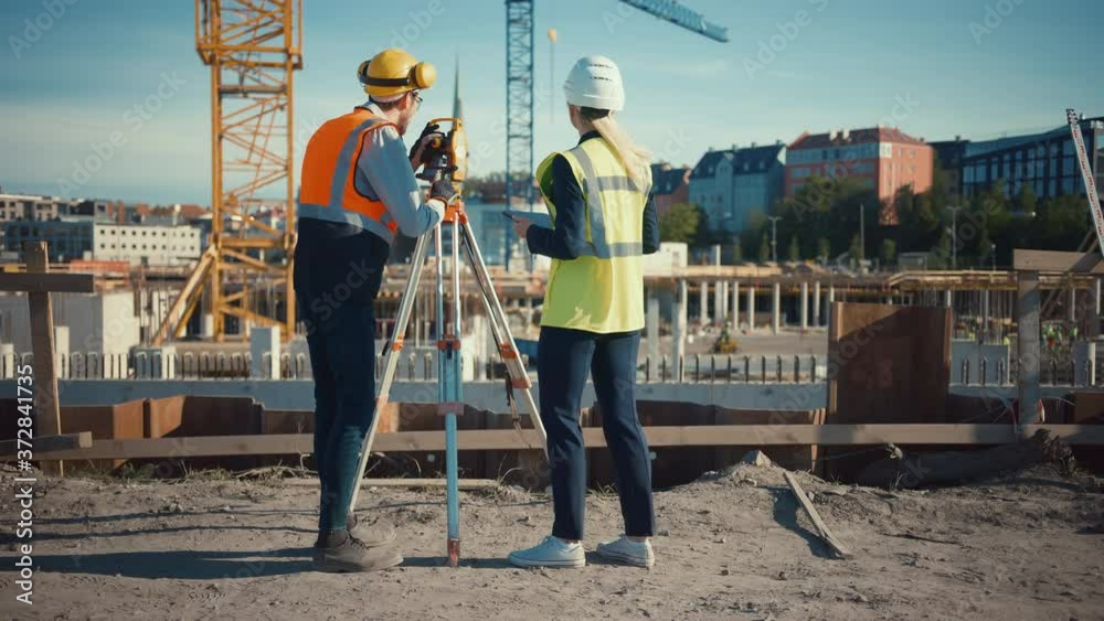 Construction Worker Using Theodolite Surveying Optical Instrument for ...