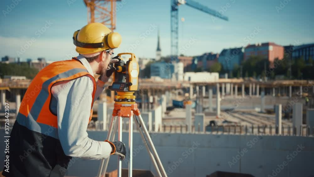 Construction Worker Using Theodolite Surveying Optical Instrument for ...