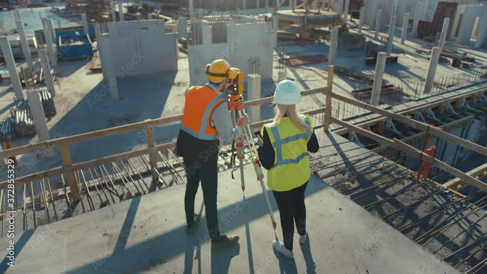 Construction Worker Using Theodolite Surveying Optical Instrument for ...