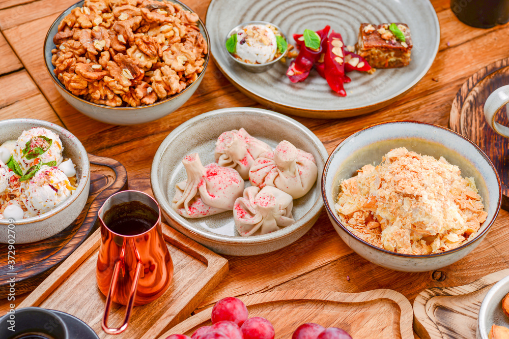 Traditional Georgian sweets and desserts. Baklava, nakhini, khinkali ...