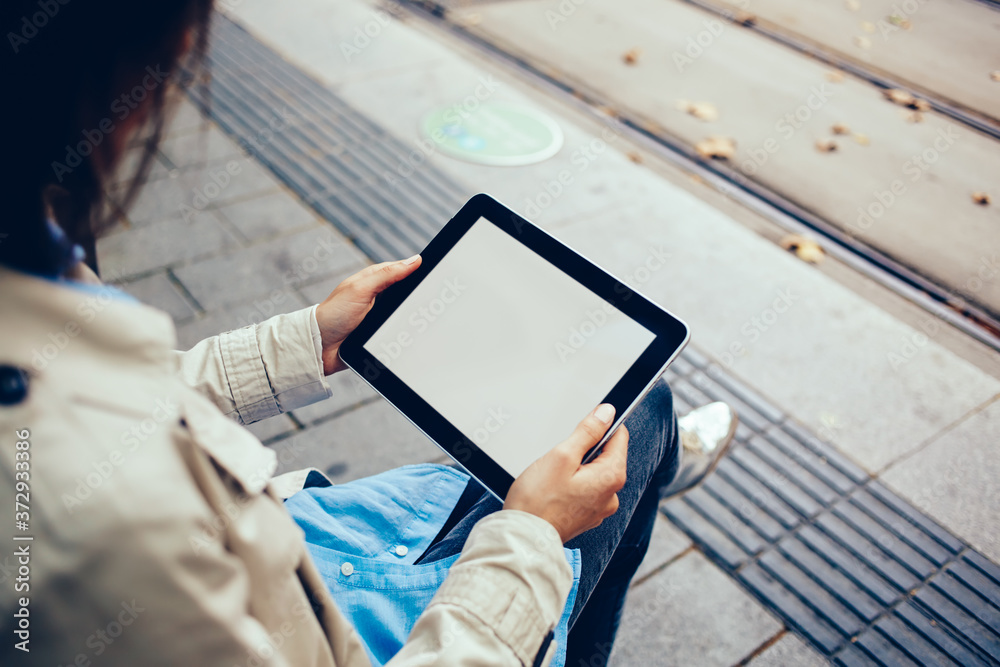 Cropped view of female person holding digital touch pad with copy space ...
