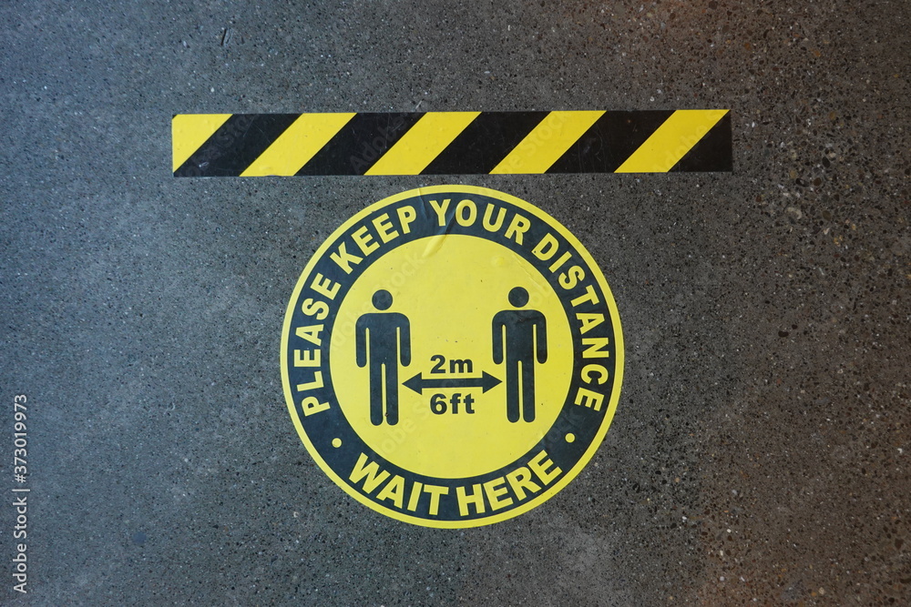 yellow circle symbol sign printed on ground at US store informing ...