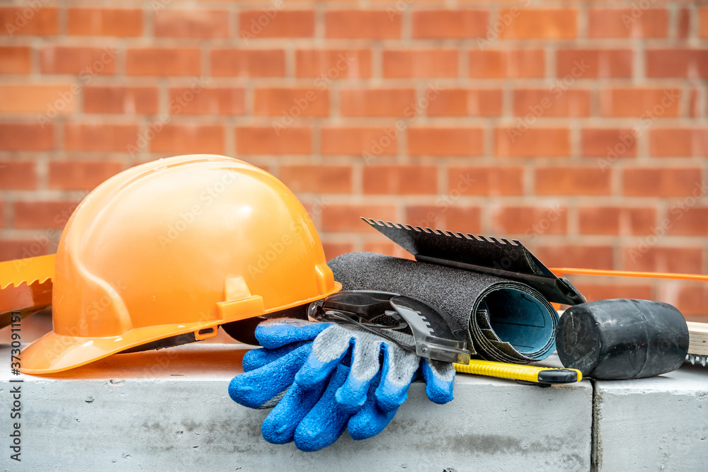 Set of construction tools on aerated concrete blocks on the background ...