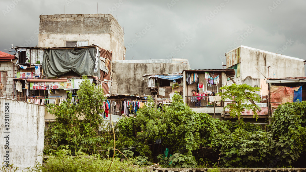 Manila, Philippines - A squatter area in Manila with vegetation and ...