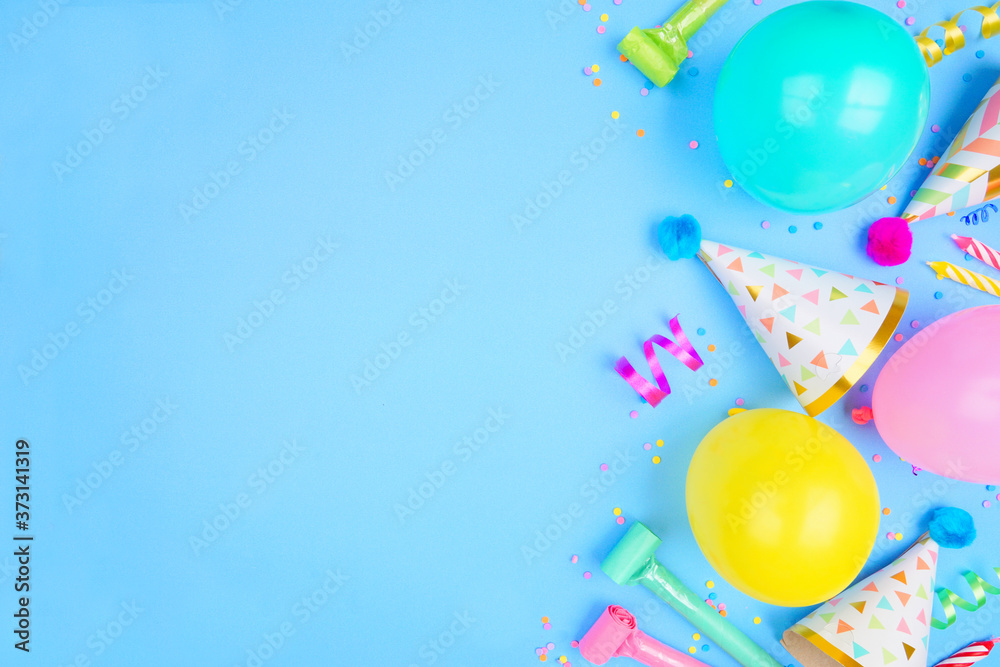 Birthday party side border on a blue background. Above view with ...