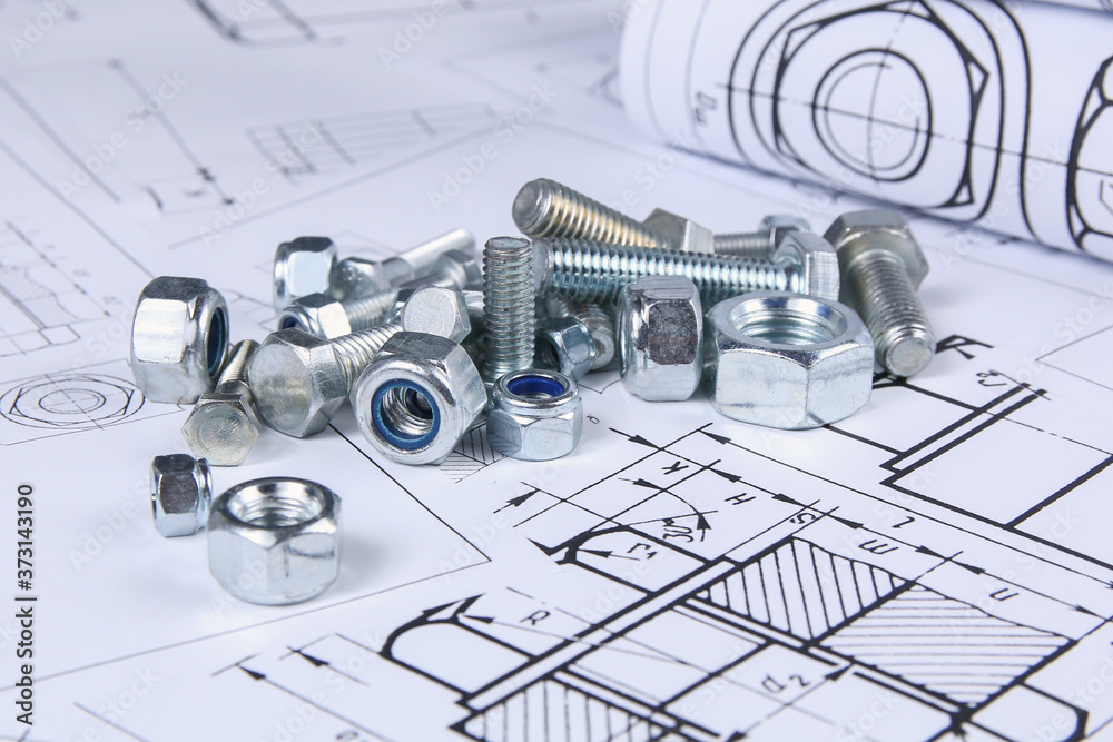 Hardware bolts and nuts on paper engineering drawings Stock Photo ...
