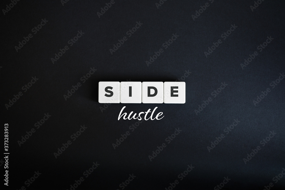 Side Hustle Banner. Block letters and curvise font on the black paper ...
