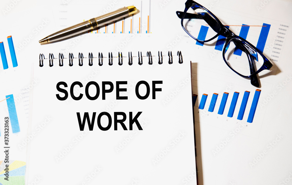 Scope of work. inscription on a white business card against the ...