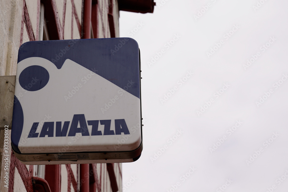 Lavazza logo and sign of coffee shop advertising front of bar building ...