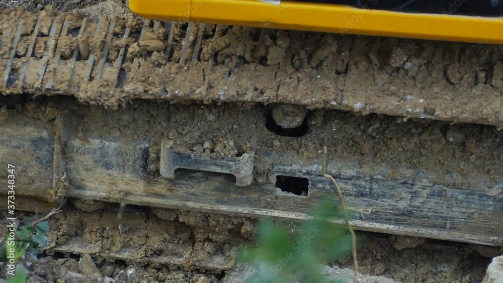 Slow motion Continuous Track Chain of an excavator. Tank tread spinning ...
