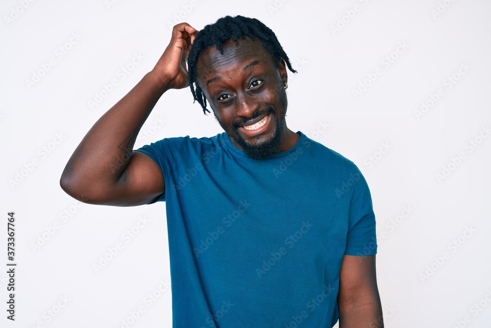 Young african american man with braids wearing casual clothes confuse ...