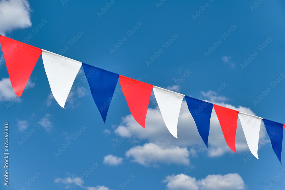 Red white and blue triangular bunting on sky background Stock Photo ...