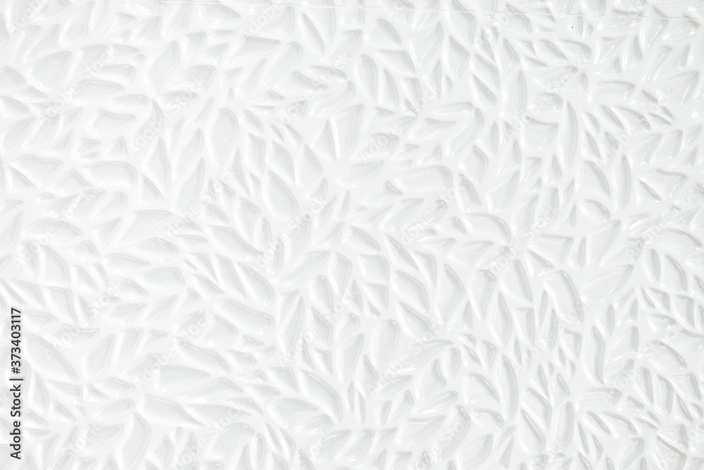 White tiles with leaf texture for texture background and copy space ...