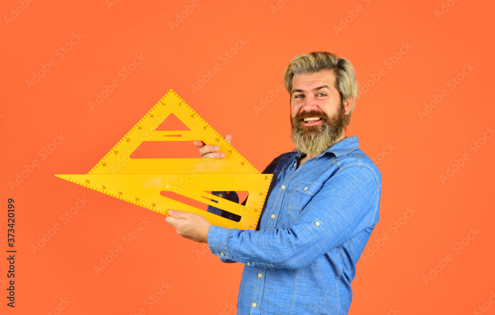 Auxiliary equipment. Architect education. Bearded man teacher use ruler ...