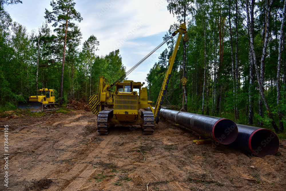 Pipelayer with side boom Installation of gas and crude oil pipes in ...