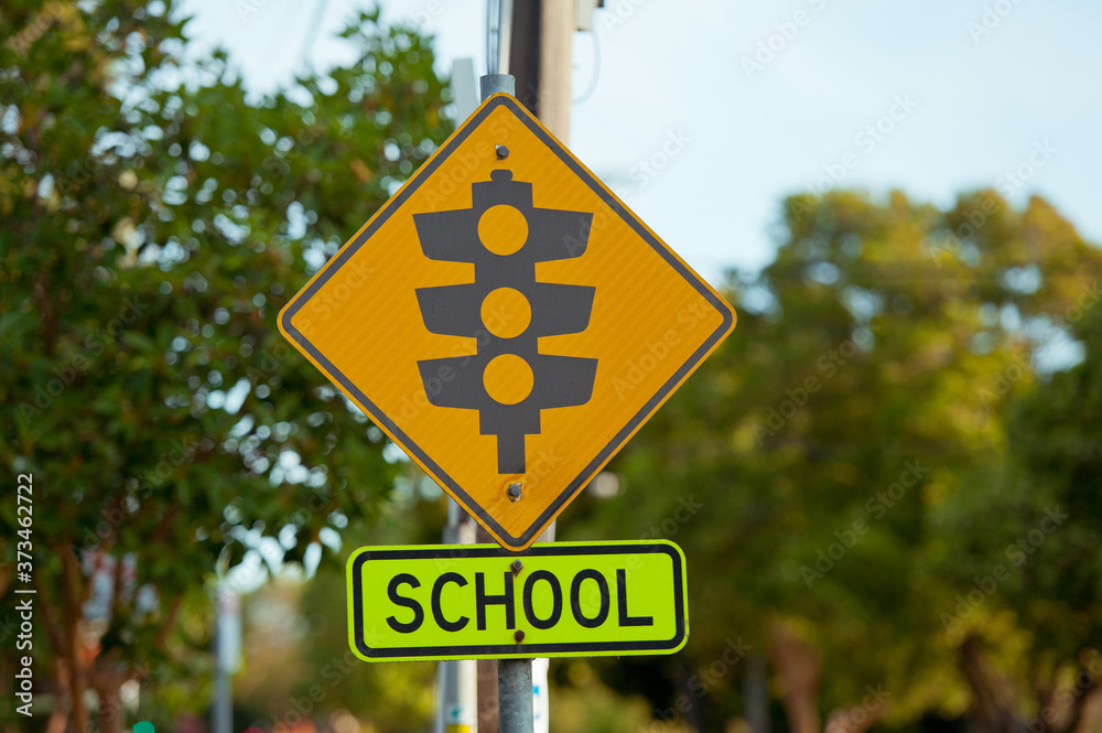 Road sign Australia Melbourne. School area. Traffic light ahead. Stock ...