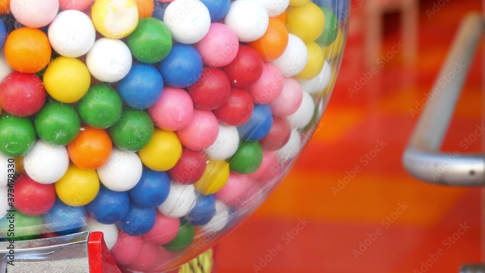 Colorful gumballs in classic vending machine, USA. Multi colored buble ...