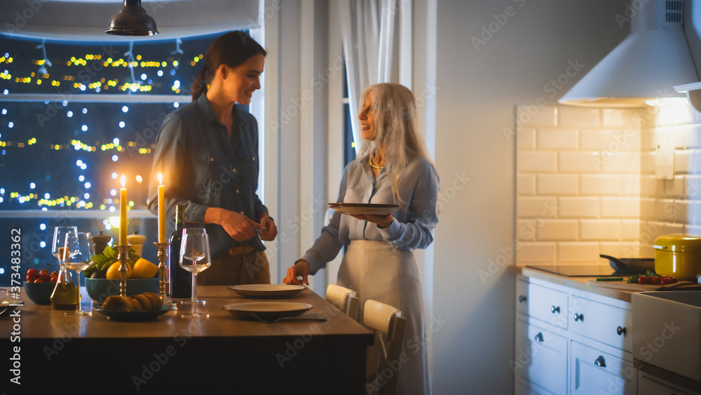 Multi Generations of Beautiful Women Preparing and Serving Dinner in ...