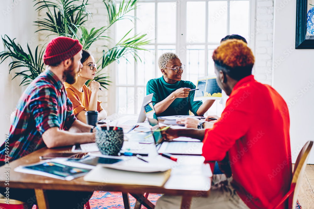 African American coach training multiracial group of skilled ...