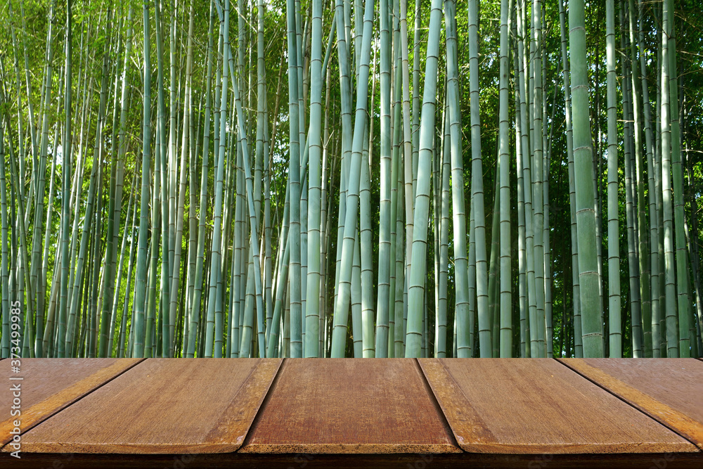 Bamboo forest background with wood table. Stock Photo | Adobe Stock