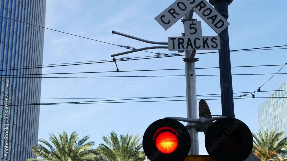 Level crossing warning signal in USA. Crossbuck notice and red traffic ...