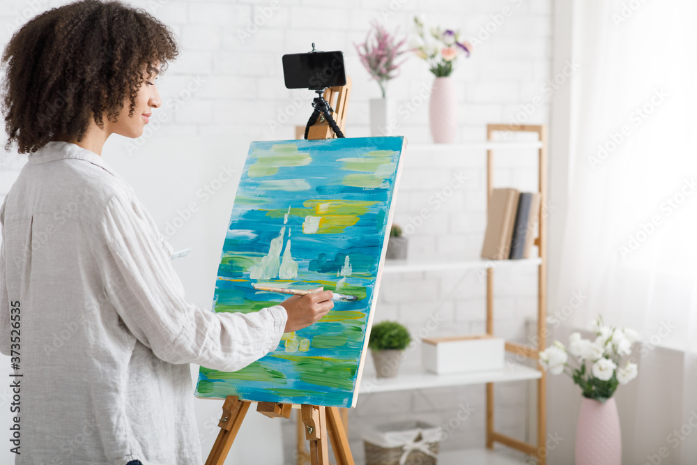 Online drawing lesson with teacher. Woman draws a picture and makes ...