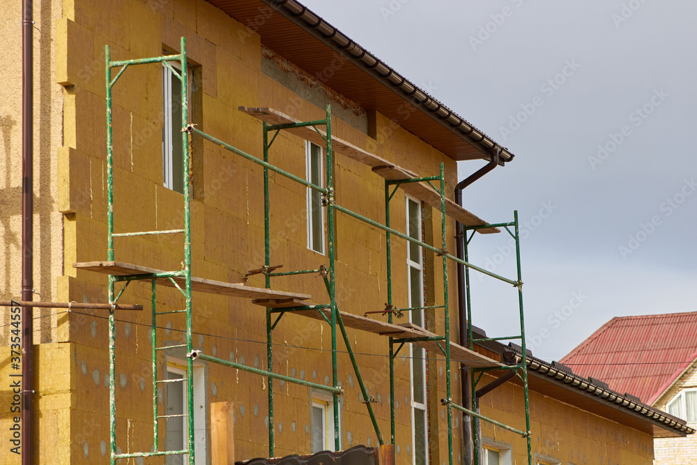 warming of a facade by mineral wool, Exterior house wall heat ...