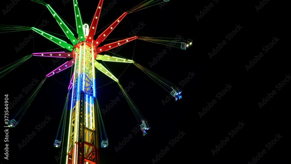 4K video of a Swing tower ride, also known as vertical swing and flying ...