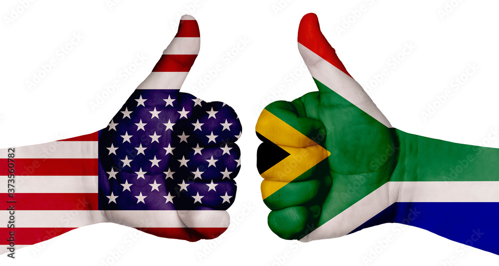 Two hands are painted with flags of different countries, with a thumb ...