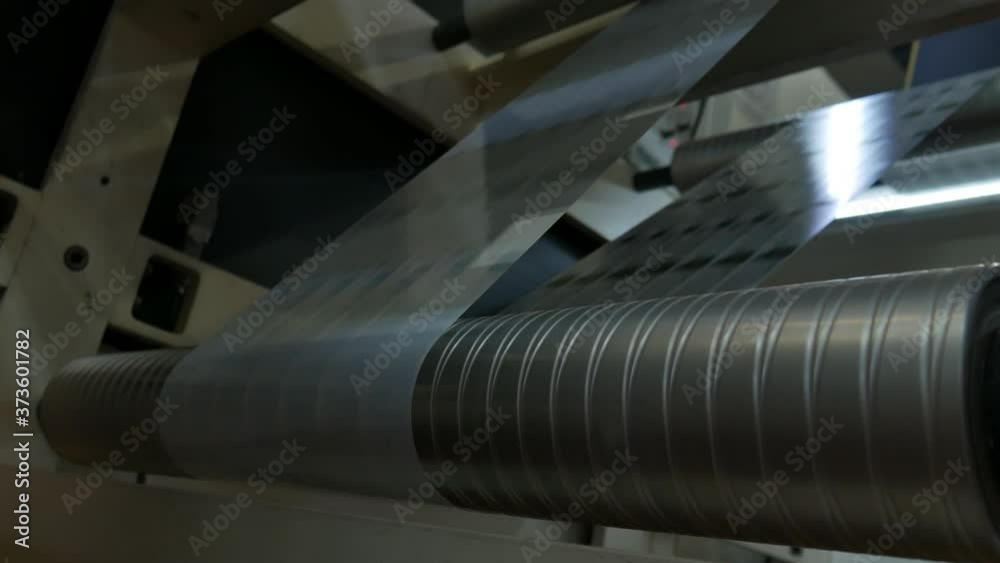 labels passing quickly in a chain production factory, an industrial ...