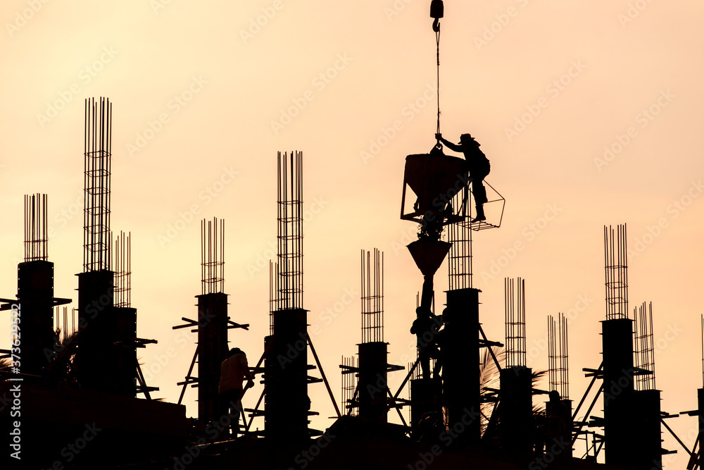 Construction workers are casting columns to build buildings using ...