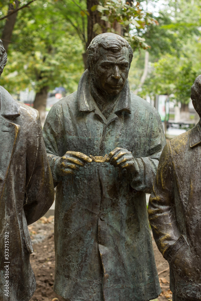 Statue of a man opening a candy bar Stock Photo | Adobe Stock