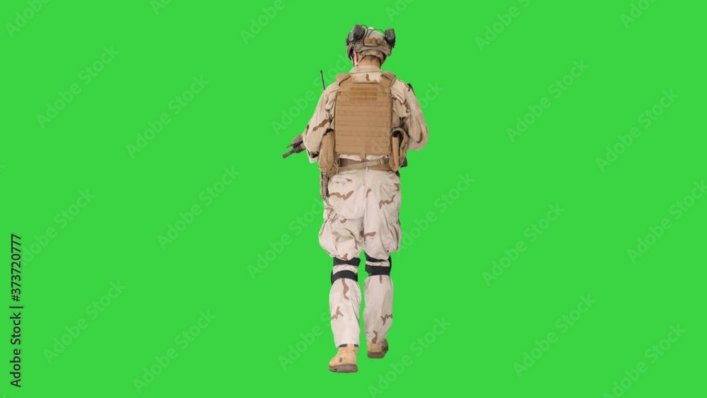 US Army ranger in combat uniform walking on a Green Screen, Chroma Key ...