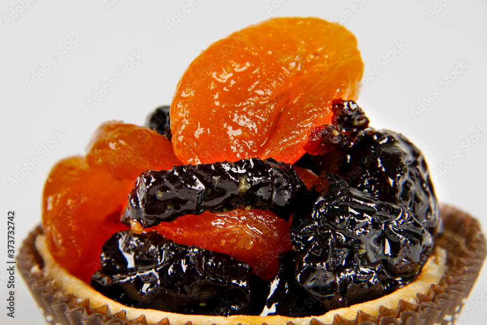 Round pie crust, with prunes and candied apricots inside. Sweet ...