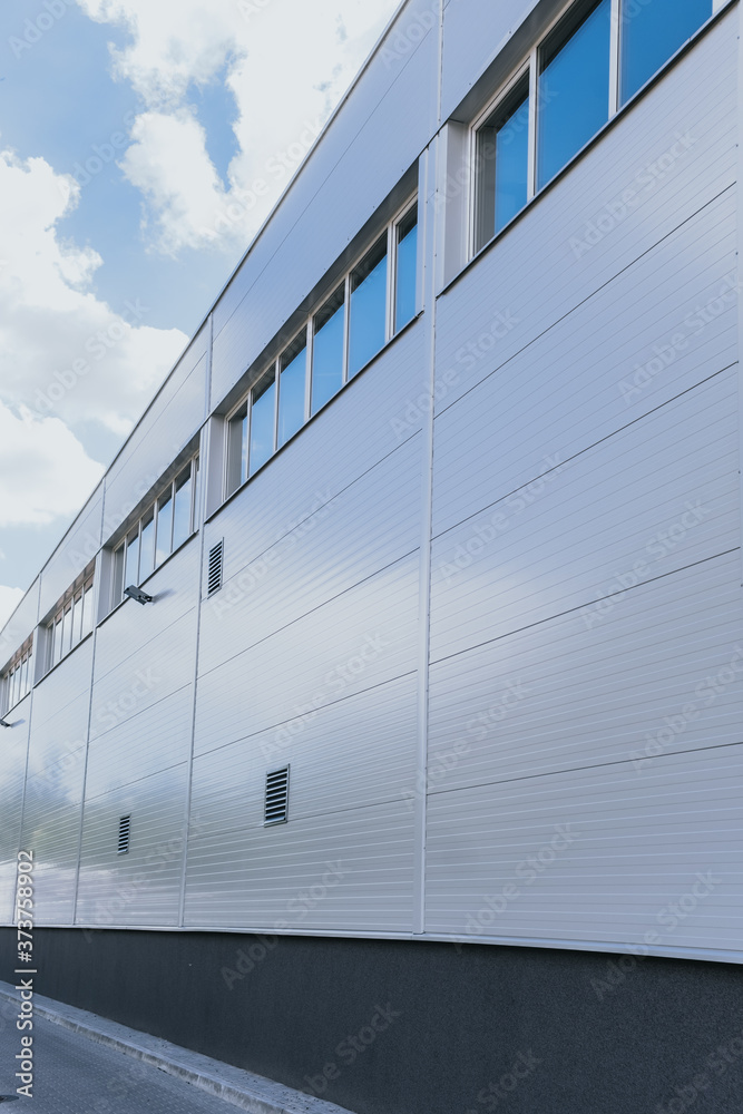 Modern white warehouse with sheet metal cladding and windows Stock ...