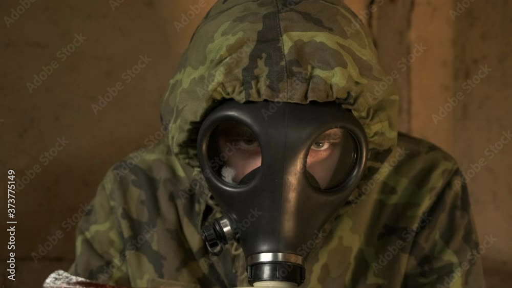 Video „A Man Axe Murderer In A Gas Mask with bloody axe look toward ...