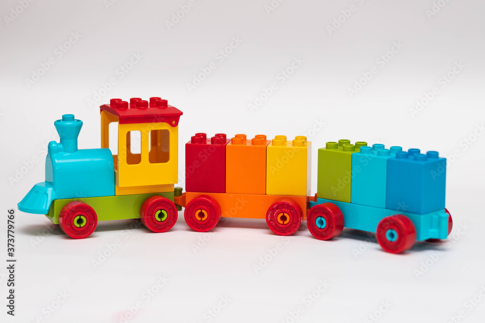Children's plastic constructor steam locomotive. Train with carriages ...