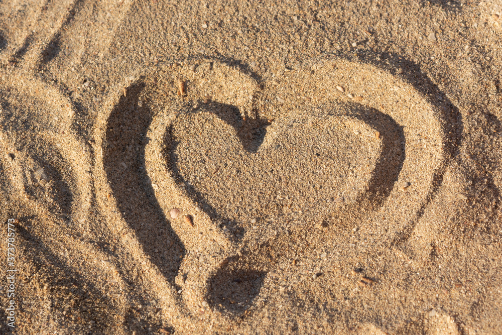 Heart on the sand as a symbol of love. The view from the top on the hot ...